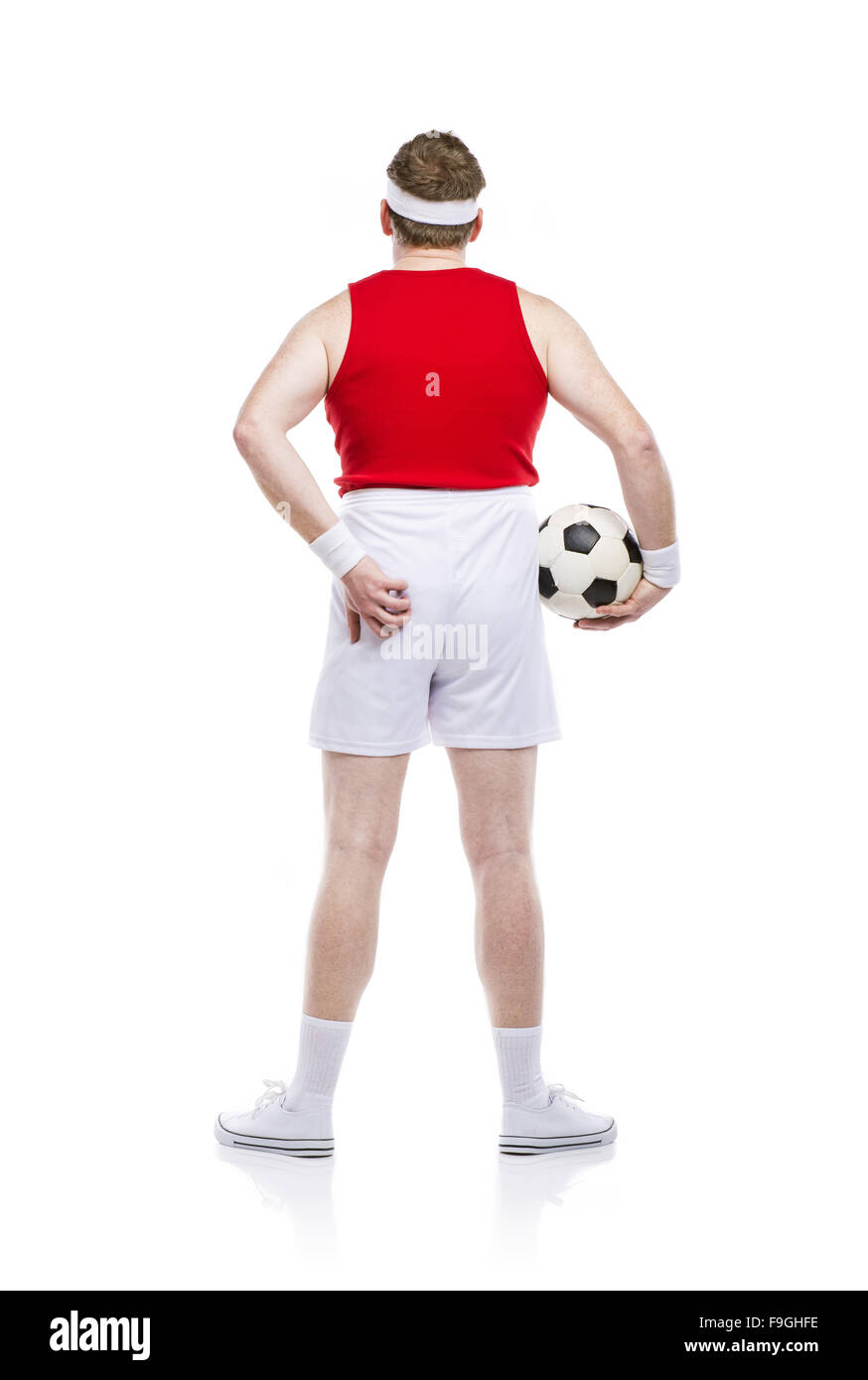 Funny weak body builder tries to exercise. Studio shot on white ...