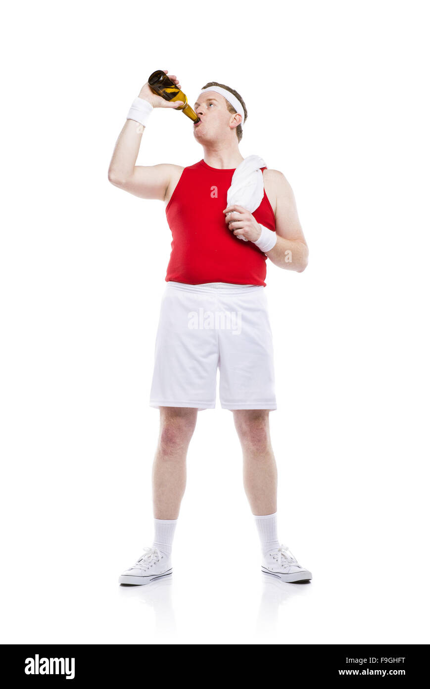 Funny weak body builder tries to exercise. Studio shot on white ...