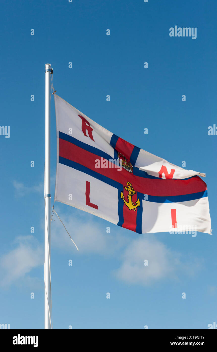 Flag of the Royal National Lifeboat Institution flying on a flag pole ...