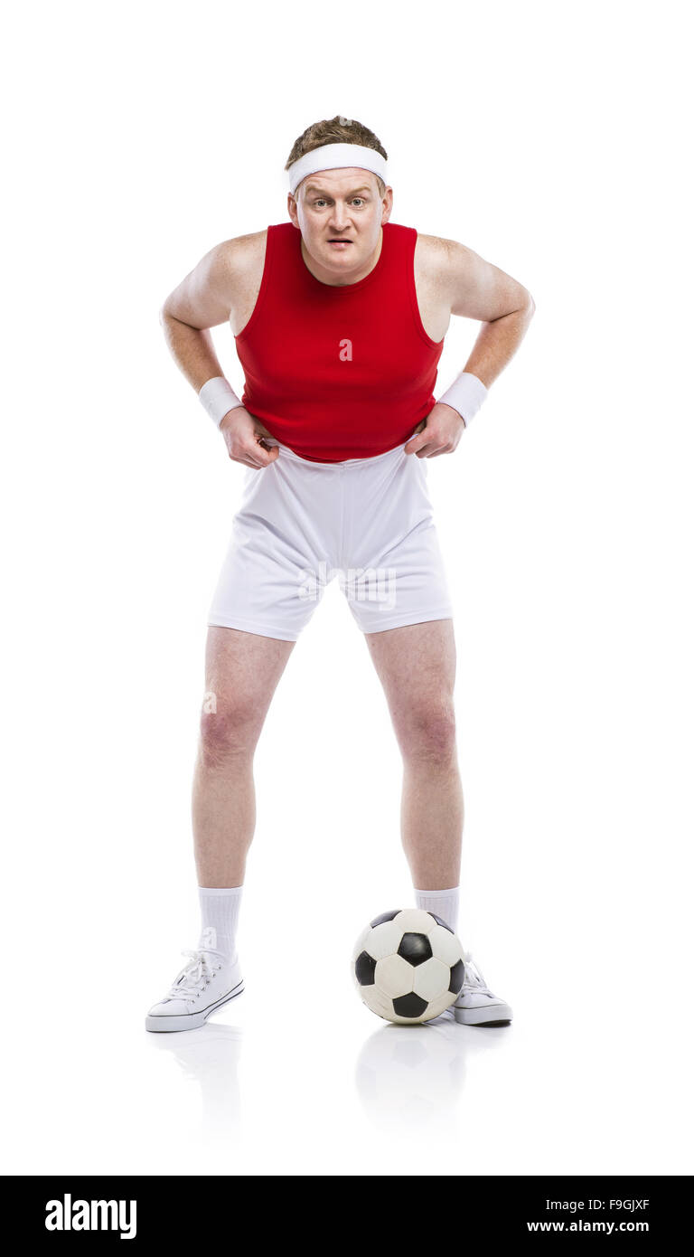 Funny clumsy football player with a ball. Studio shot on white ...