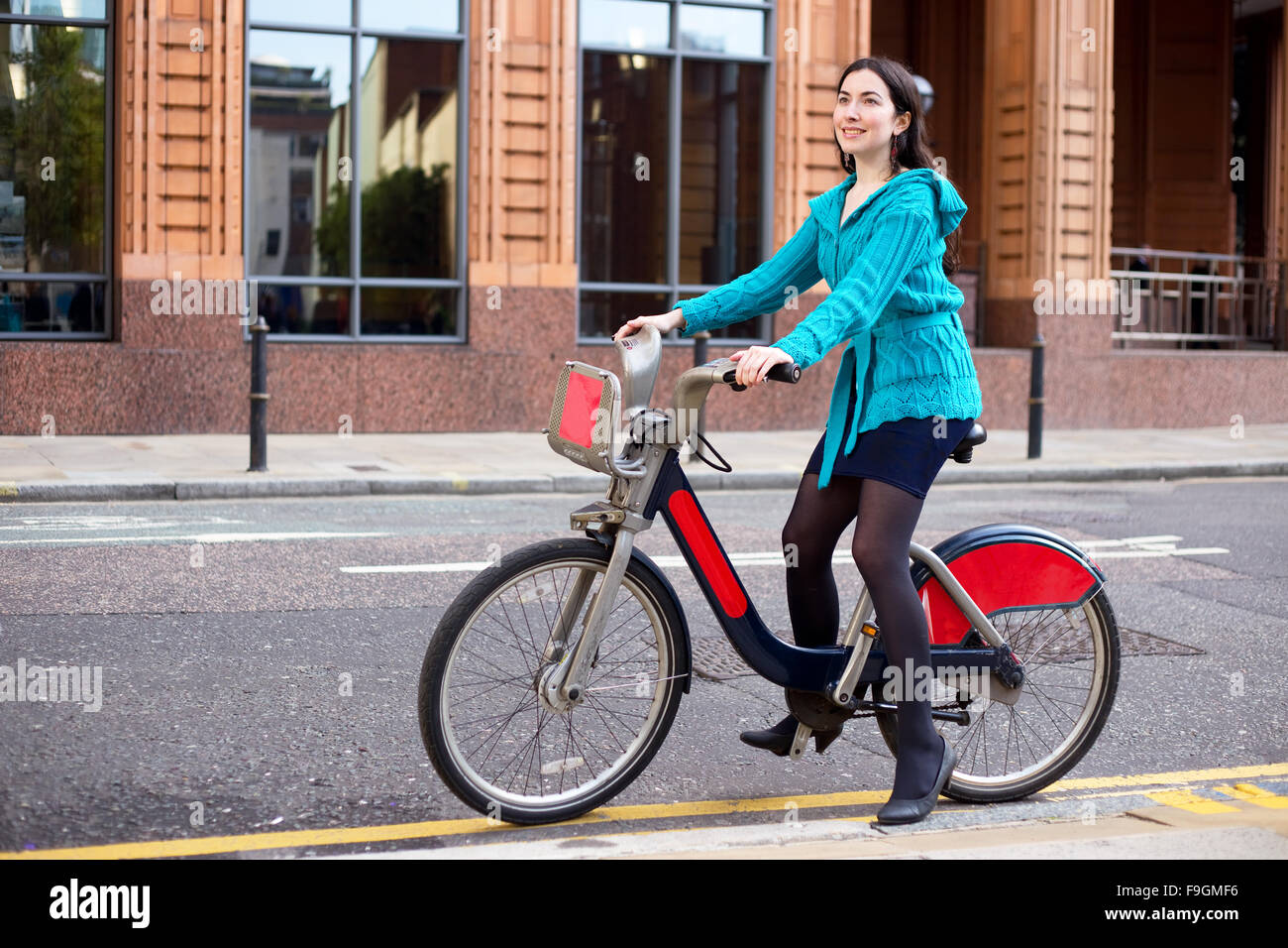 Woman riding a cycle hi-res stock photography and images - Alamy
