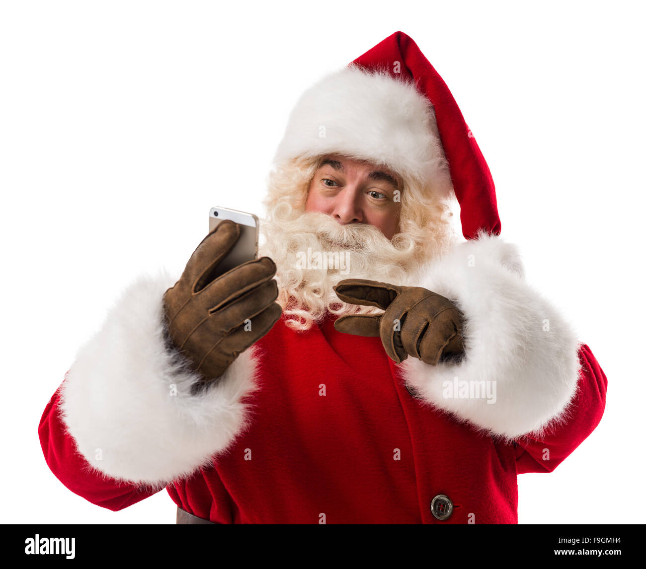Santa Claus using smartphone - calling phone or texting a message ...