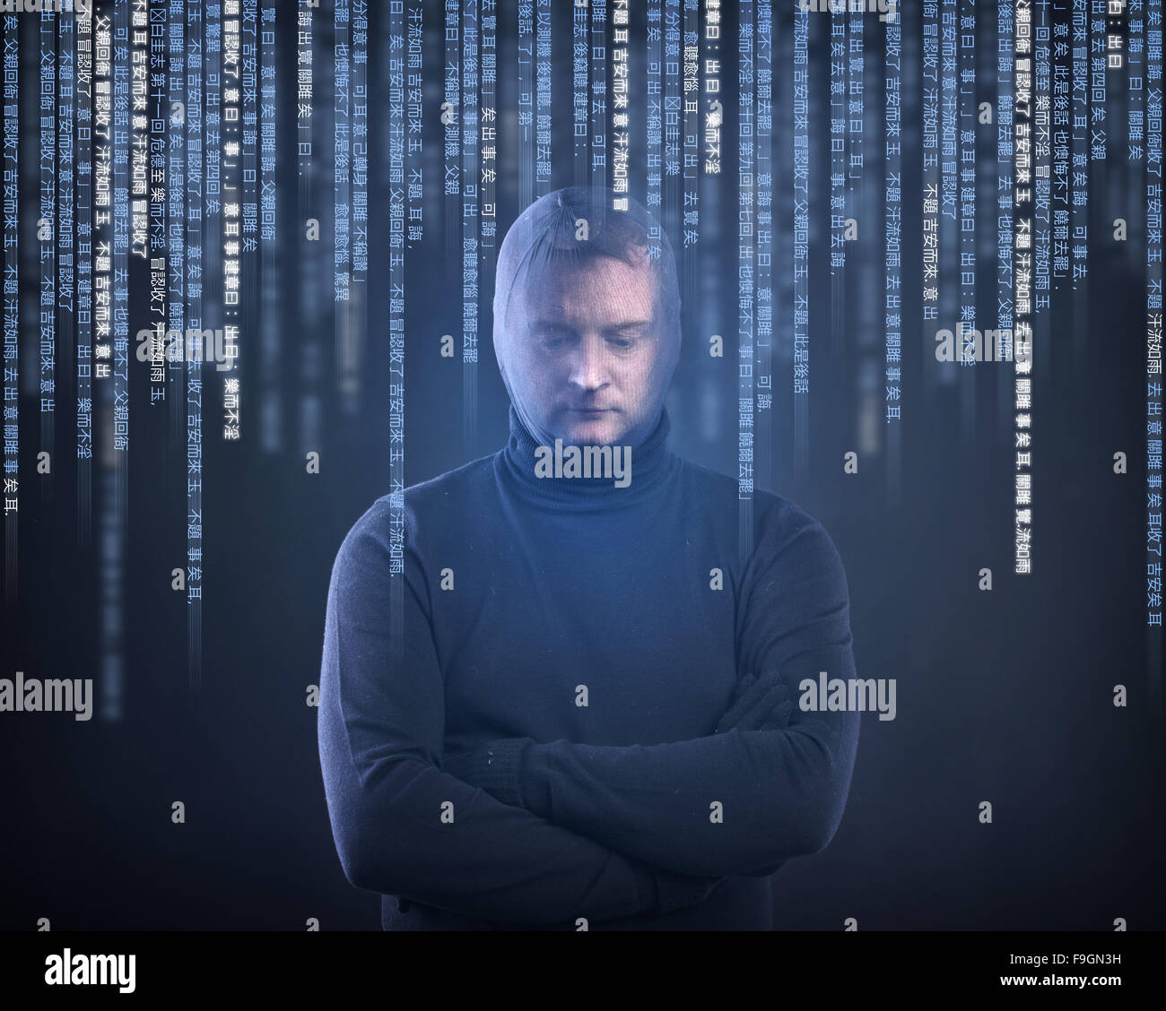 Thief in action stealing information with balaclava on his face ...