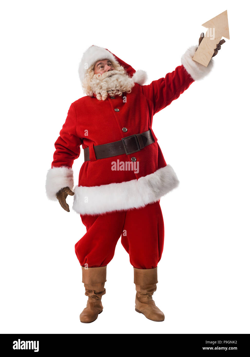 Santa Claus with wooden arrow that shows direction Full-Length Portrait ...