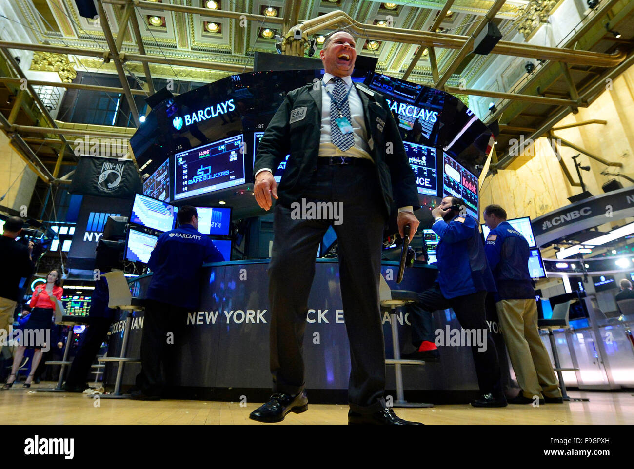 New York, USA. 16th Dec, 2015. Traders work on the floor of the New ...