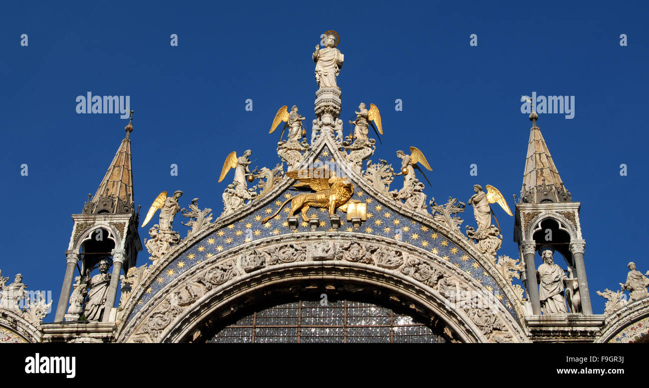Beautiful spires, frieze, and statues of San Marco Basilica in Venice ...