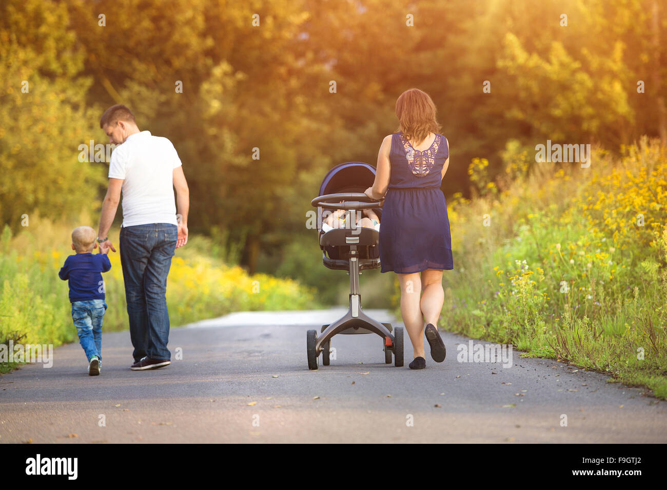 Happy family on a walk in nature enjoying life together Stock Photo - Alamy