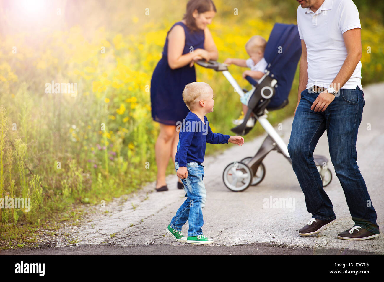 Happy family on a walk in nature enjoying life together Stock Photo - Alamy