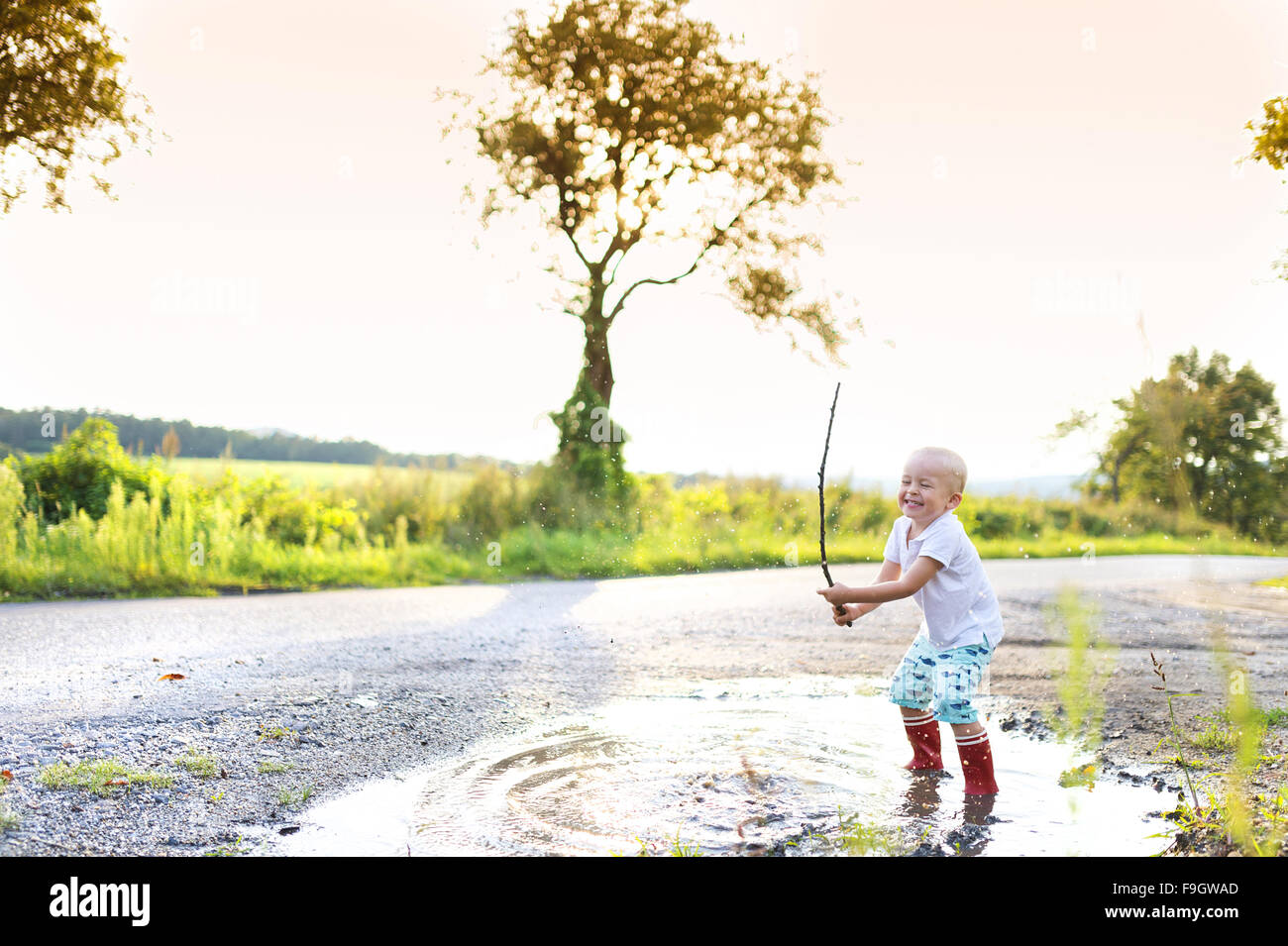 Boy playing outside hi-res stock photography and images - Alamy