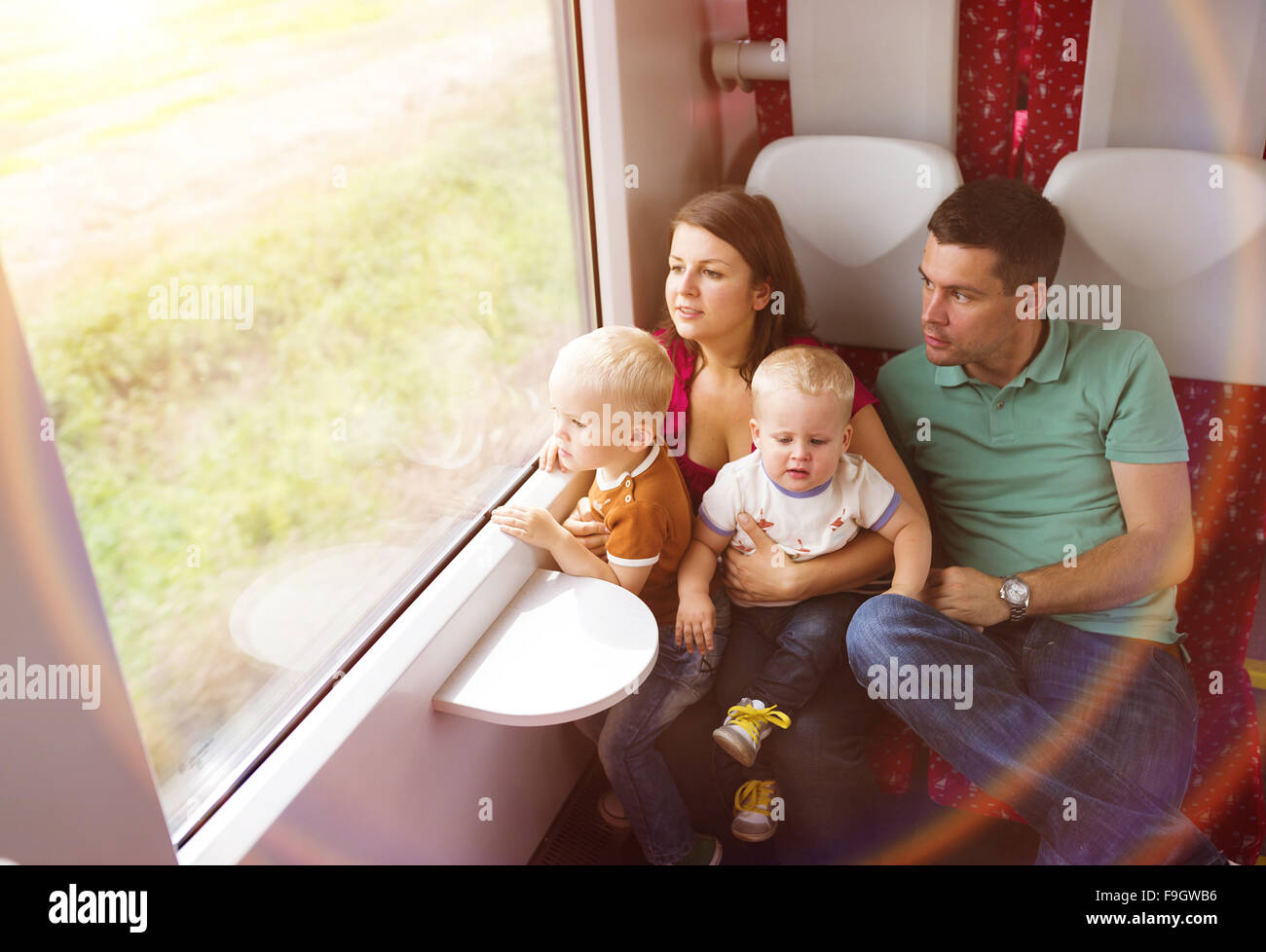 Family with two sons travel in train Stock Photo - Alamy