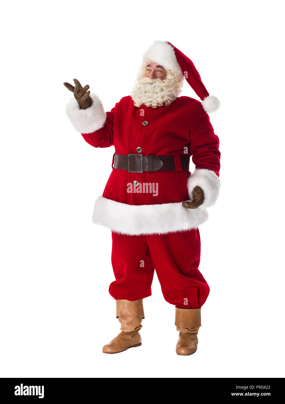 Santa Claus pointing to the left side Full Length Portrait. Isolated on ...