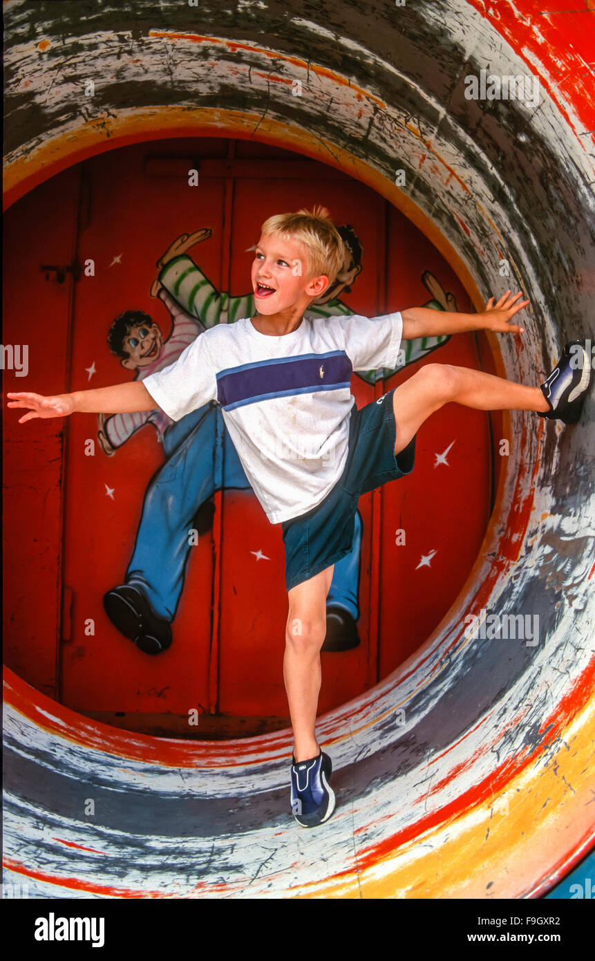 Young boy in fun house barrel Stock Photo - Alamy
