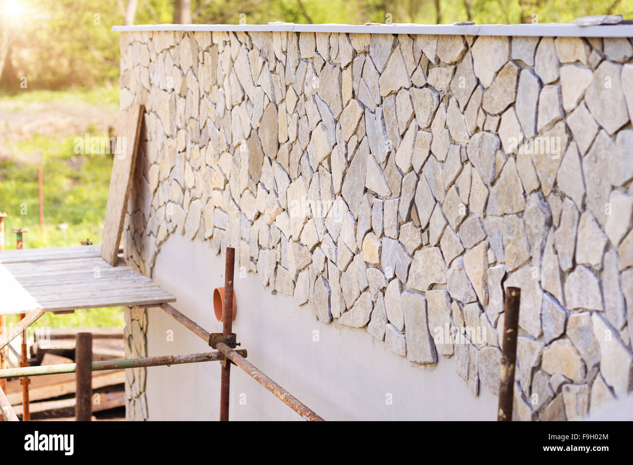 Close up of an unfinished stone wall Stock Photo - Alamy
