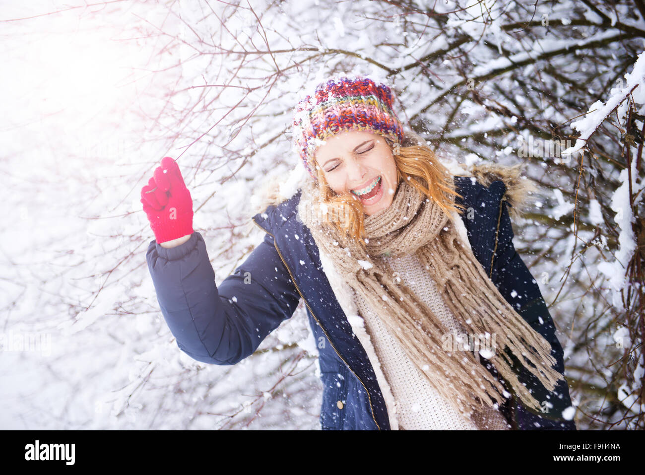 Attractive young woman having fun outside in snow Stock Photo - Alamy
