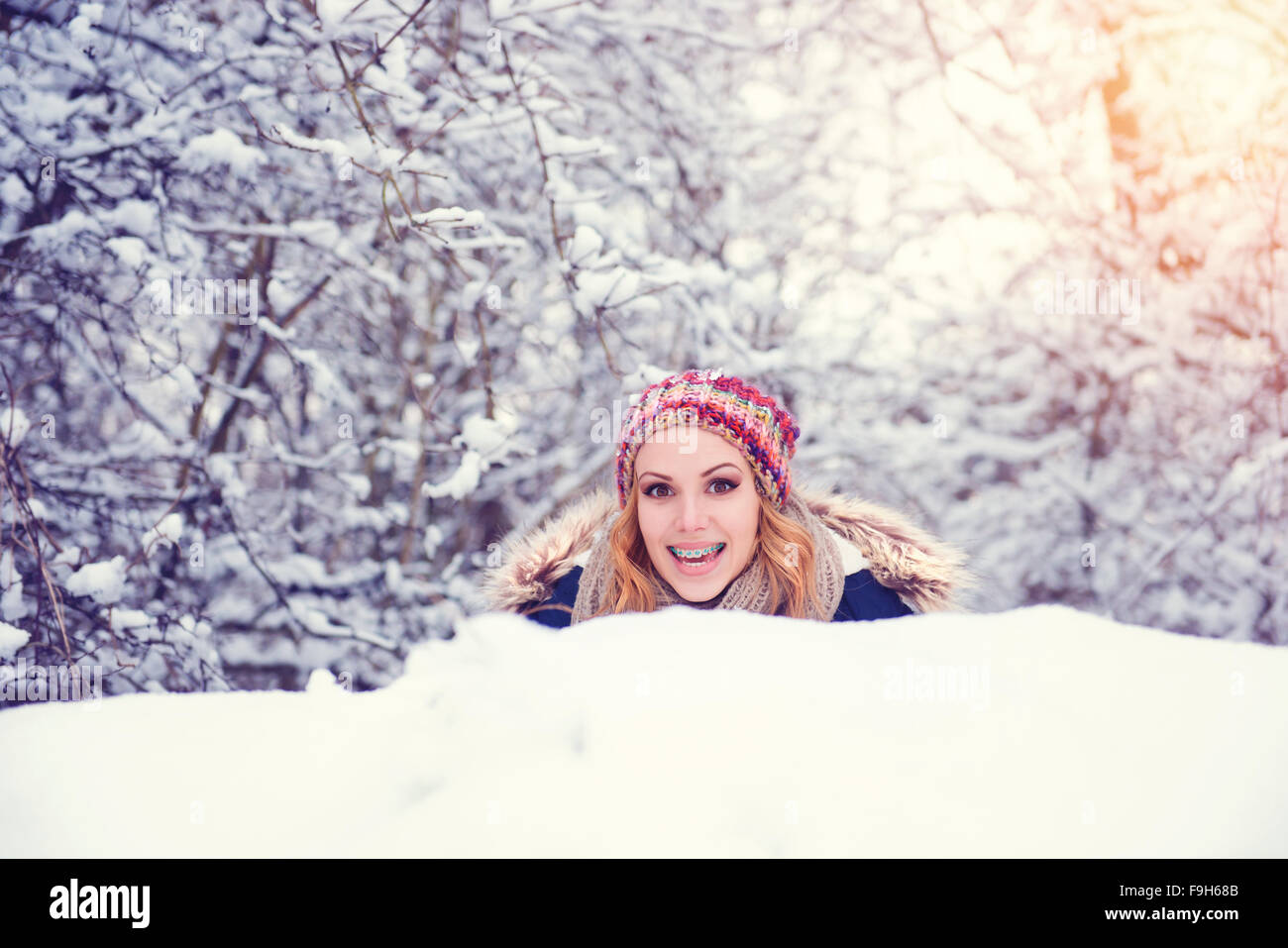 Attractive young woman having fun outside in snow Stock Photo - Alamy