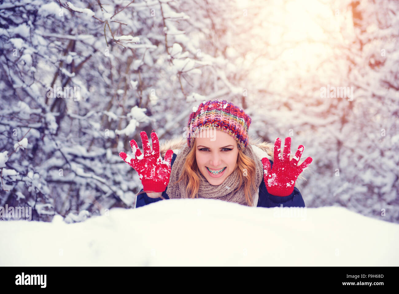 Attractive young woman having fun outside in snow Stock Photo - Alamy