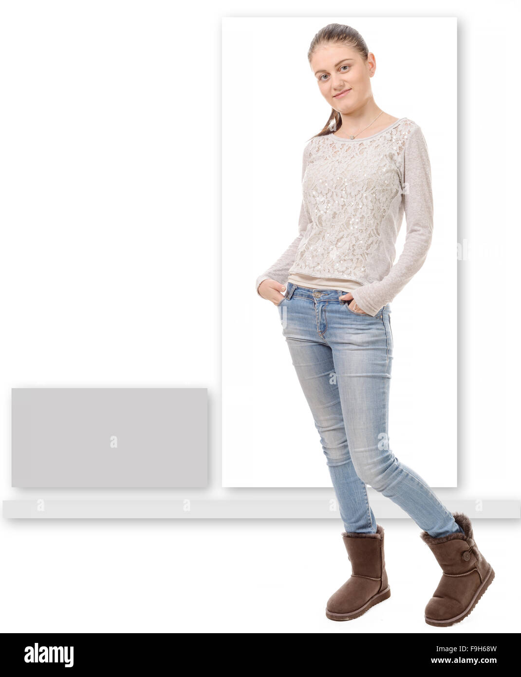 a pretty young woman standing with boots Stock Photo - Alamy