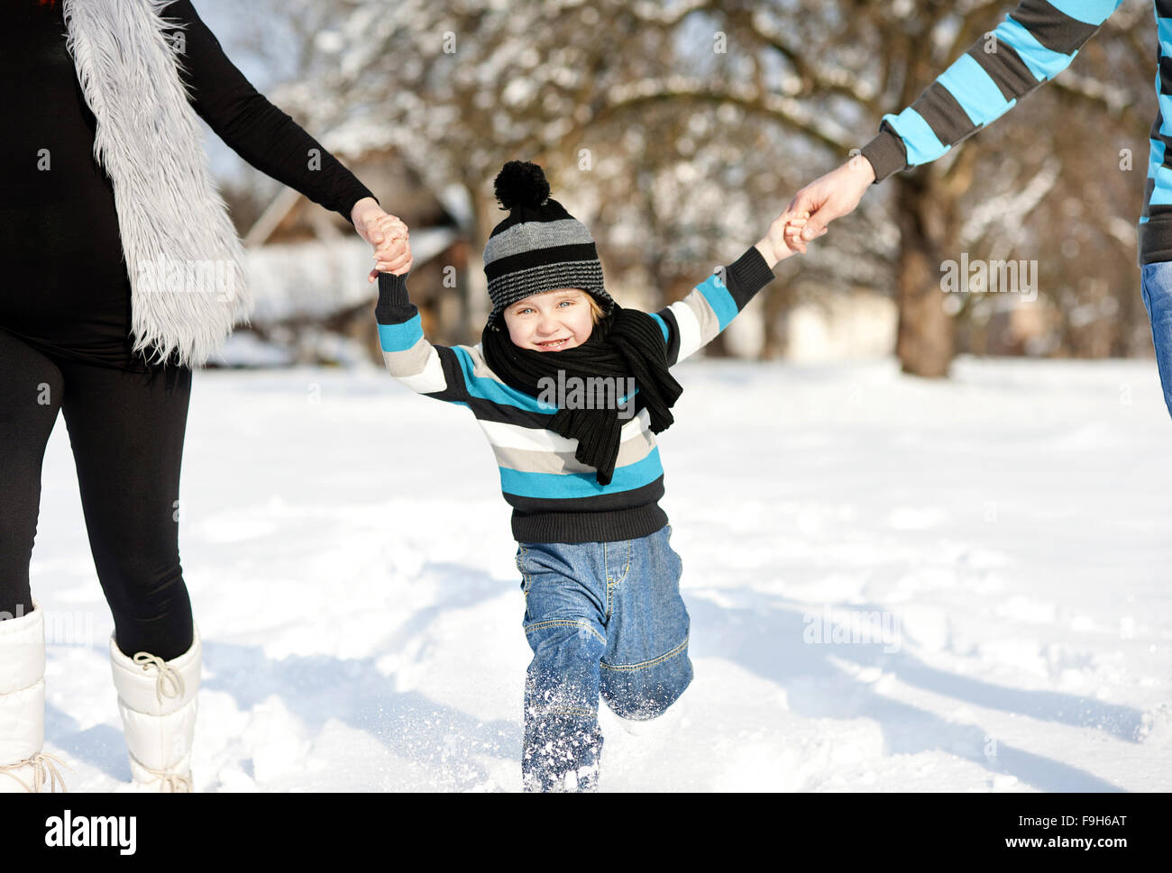 Cute little boy playing outside in the snow in winter Stock Photo - Alamy