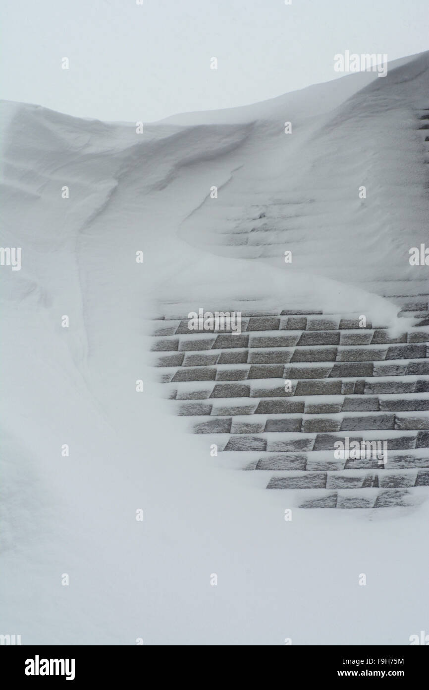Snow accumulation on shingle roof during blowing snow storm Stock Photo ...