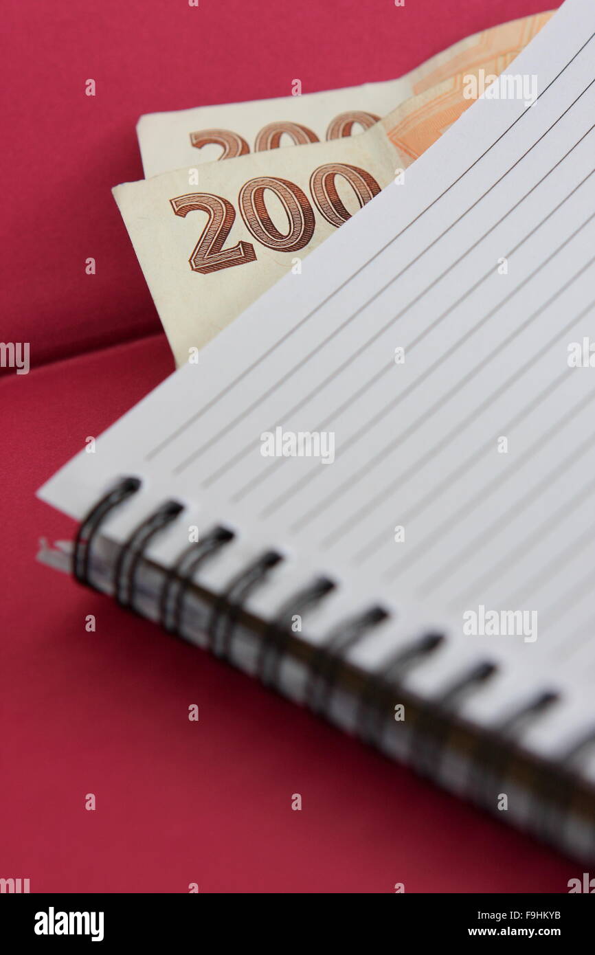 Money and Notebook Stock Photo - Alamy