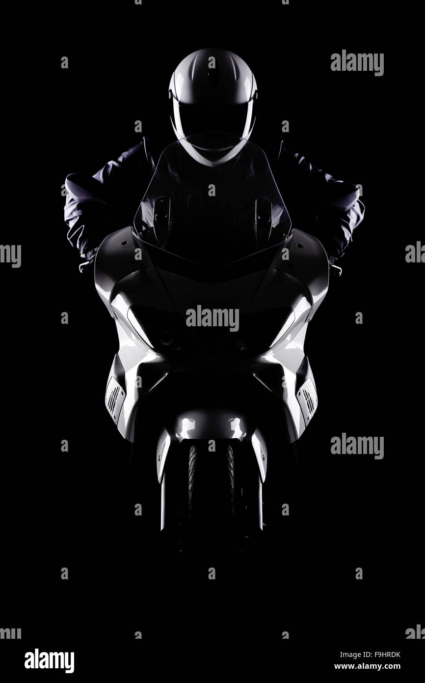 motorist on a motorcycle against black background Stock Photo - Alamy