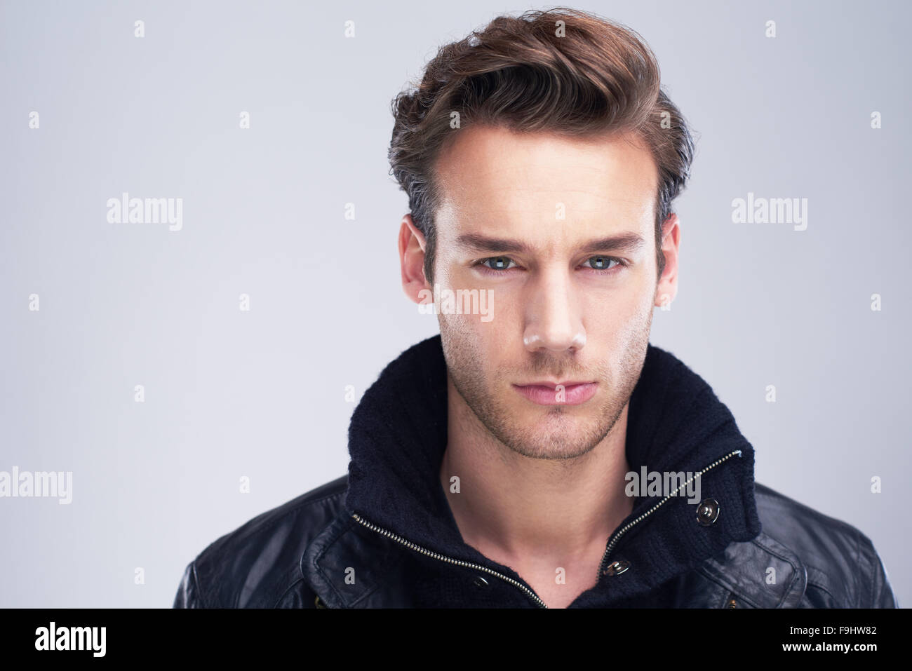 handsome young man portrait isolated on white background in studio ...