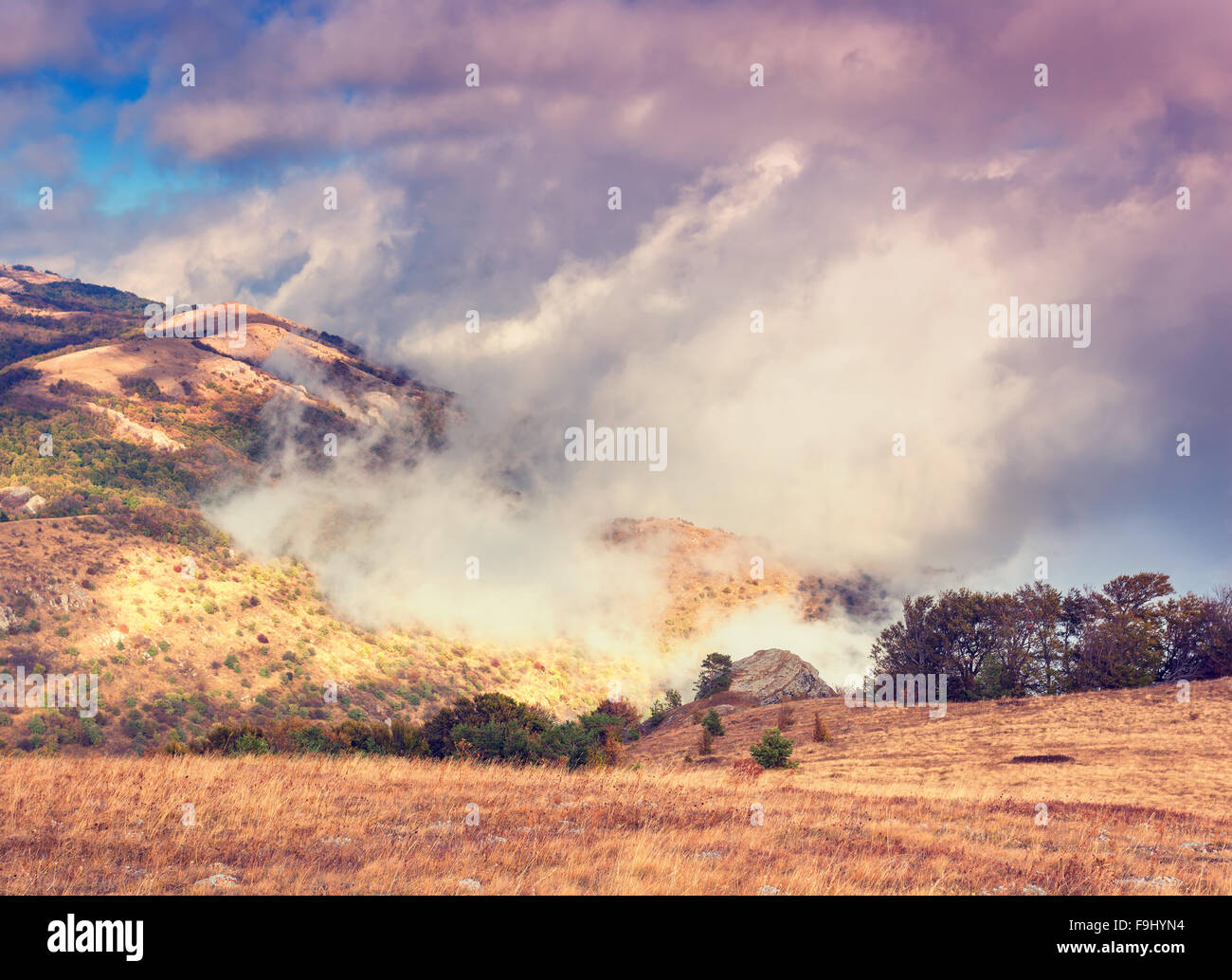 Dramatic mountain autumn landscape at sunset. Low clouds. Nature ...