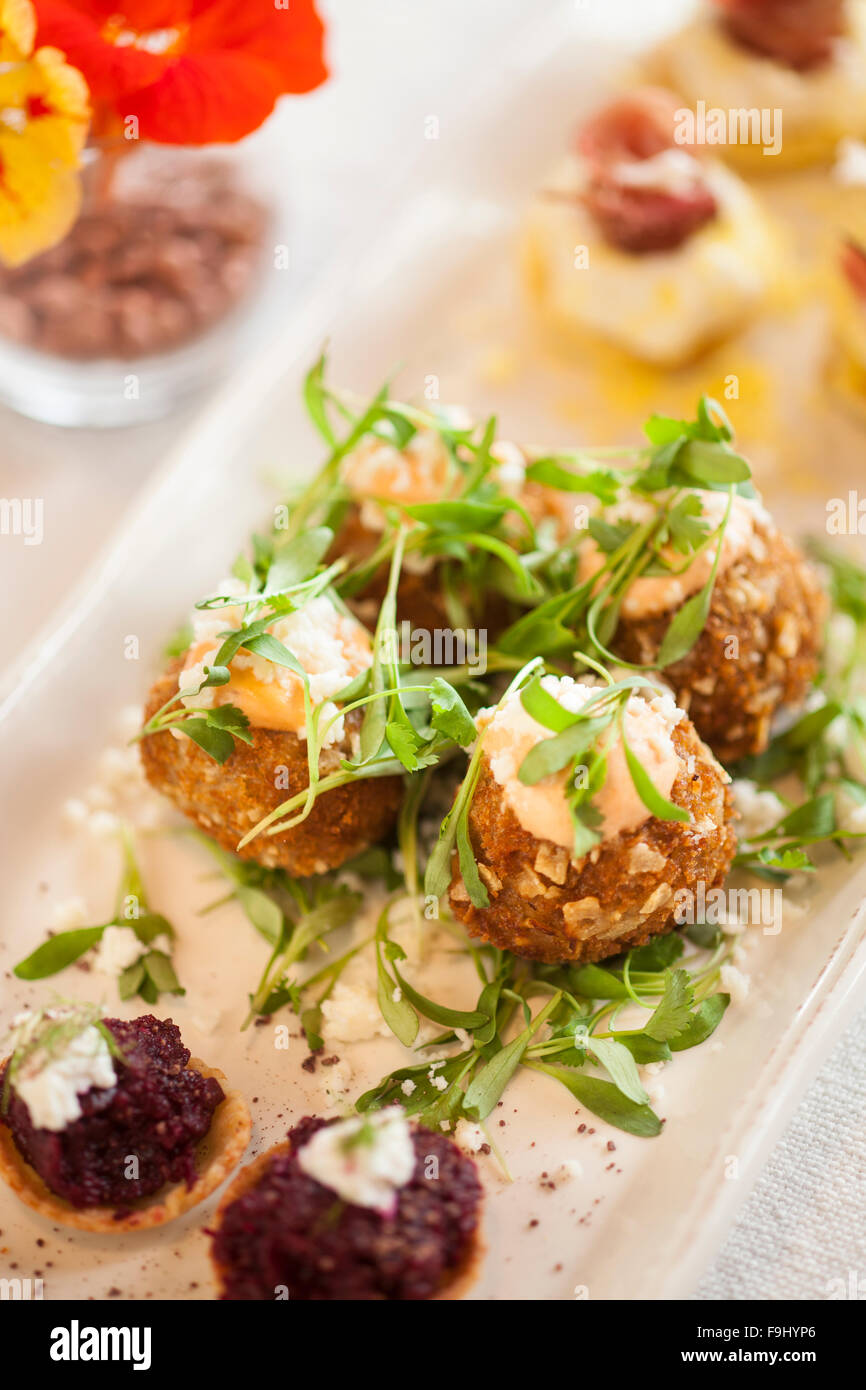 chef's plate appetizer sampler of eggamuffin, beet tarts in Parmesan ...