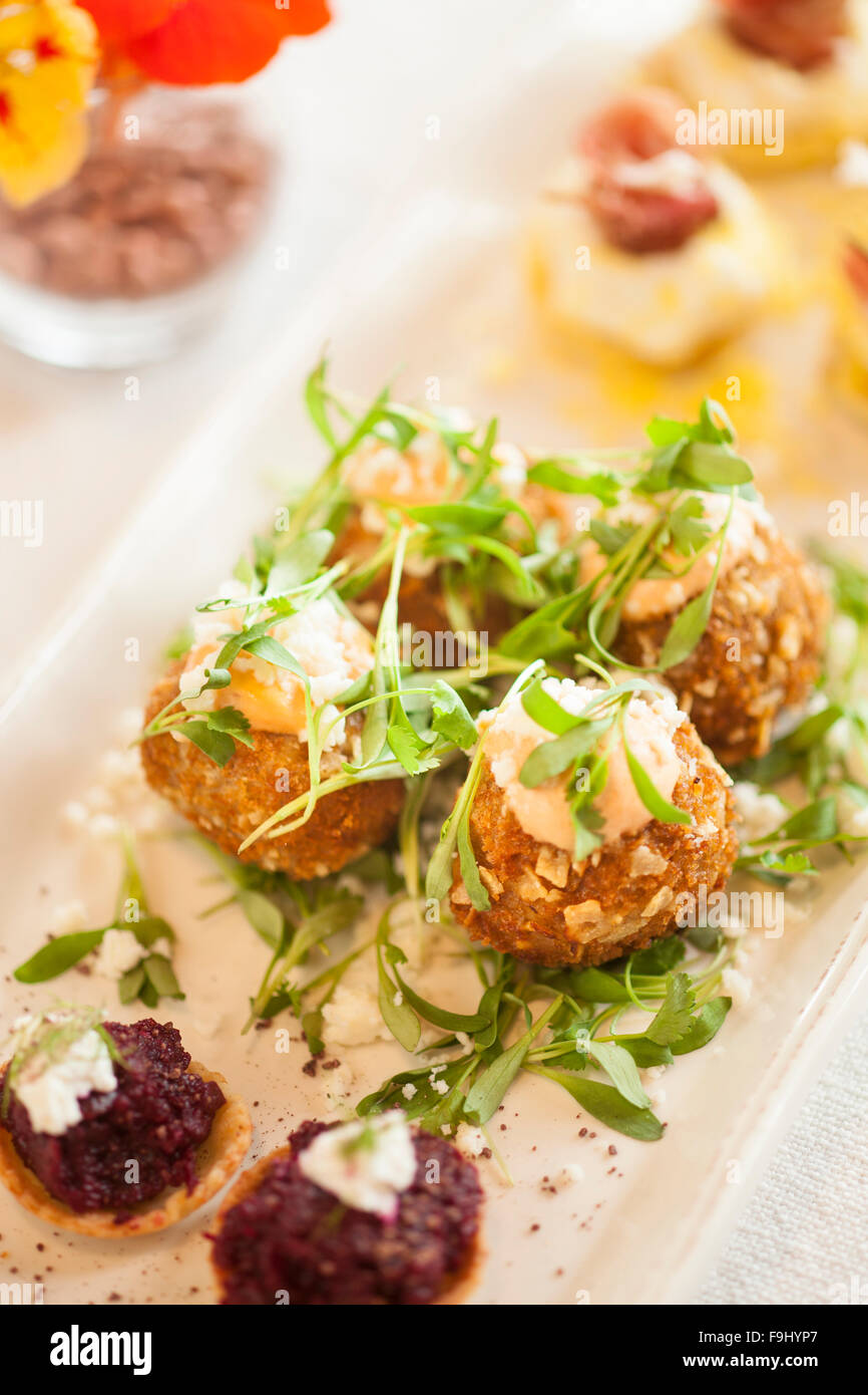 chef's plate appetizer sampler of eggamuffin, beet tarts in Parmesan ...