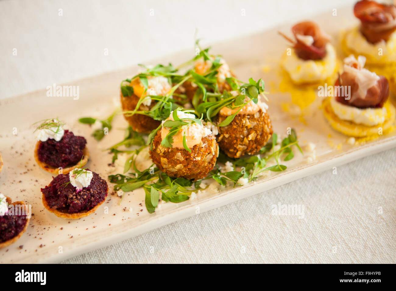 chef's plate appetizer sampler of eggamuffin, beet tarts in Parmesan ...