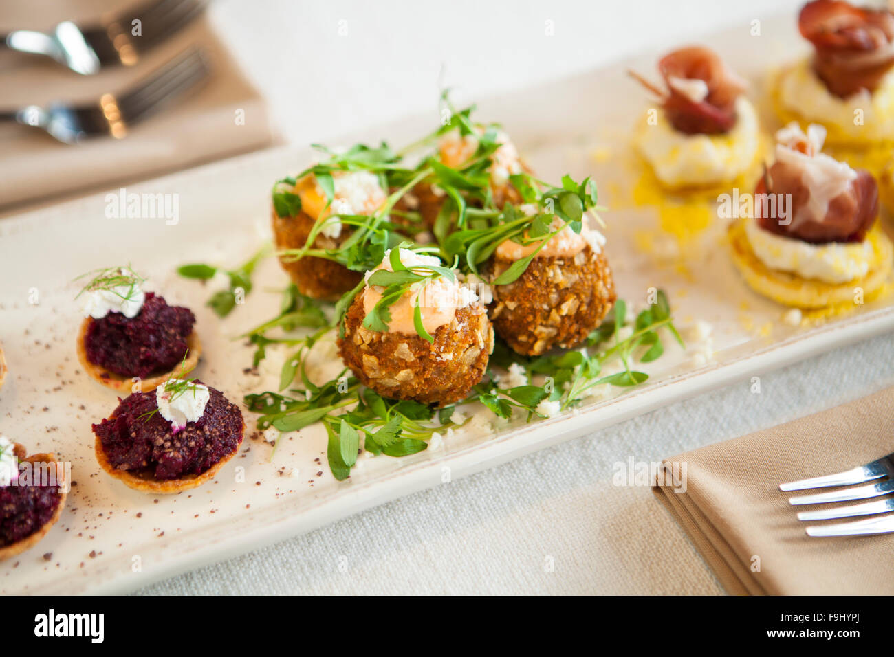 chef's plate appetizer sampler of eggamuffin, beet tarts in Parmesan ...