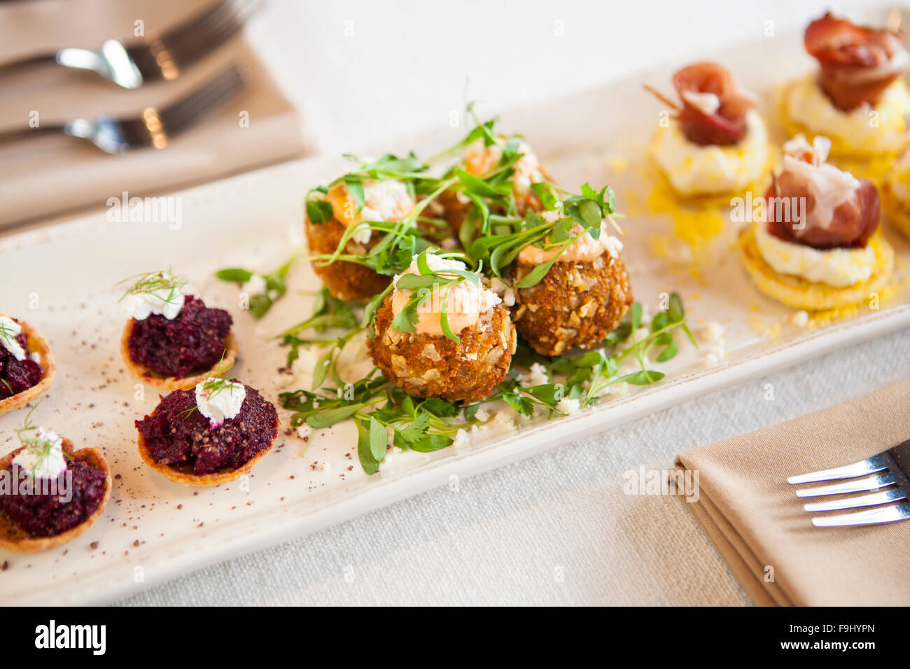 chef's plate appetizer sampler of eggamuffin, beet tarts in Parmesan ...