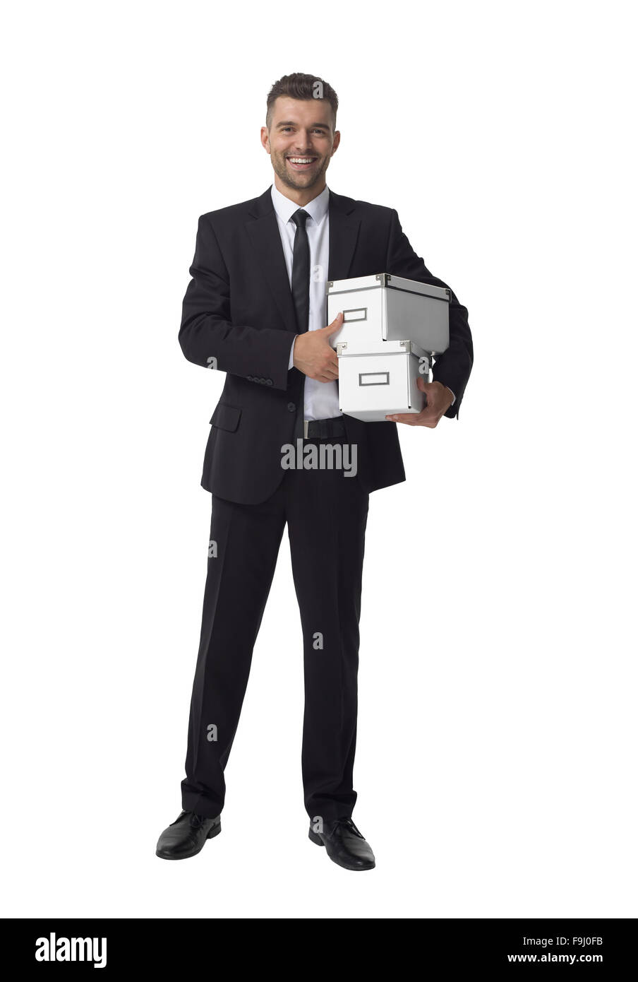 Businessman holding boxes Full Length Portrait isolated on White ...