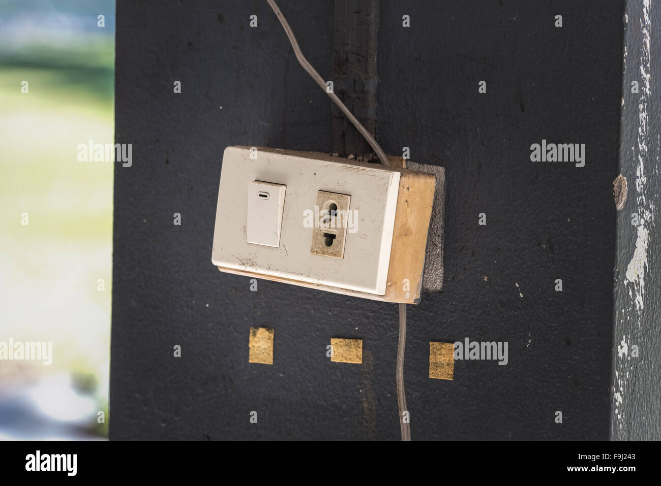 old Plastic light switch box Stock Photo - Alamy