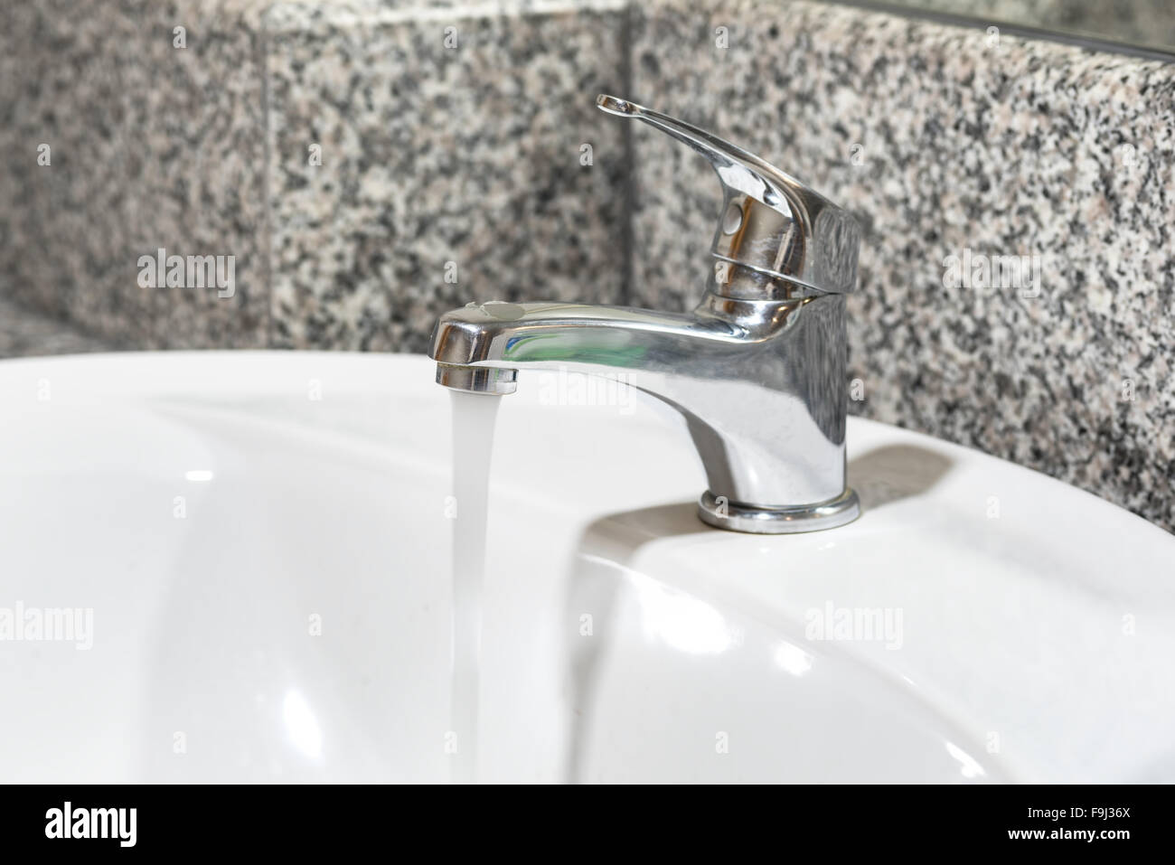 Water drop from faucet in rest room Stock Photo - Alamy