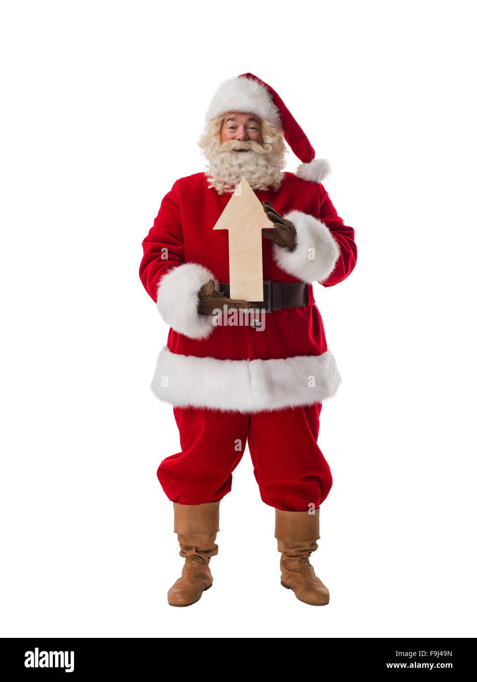Santa Claus holding wooden arrow and showing direction Full Length ...