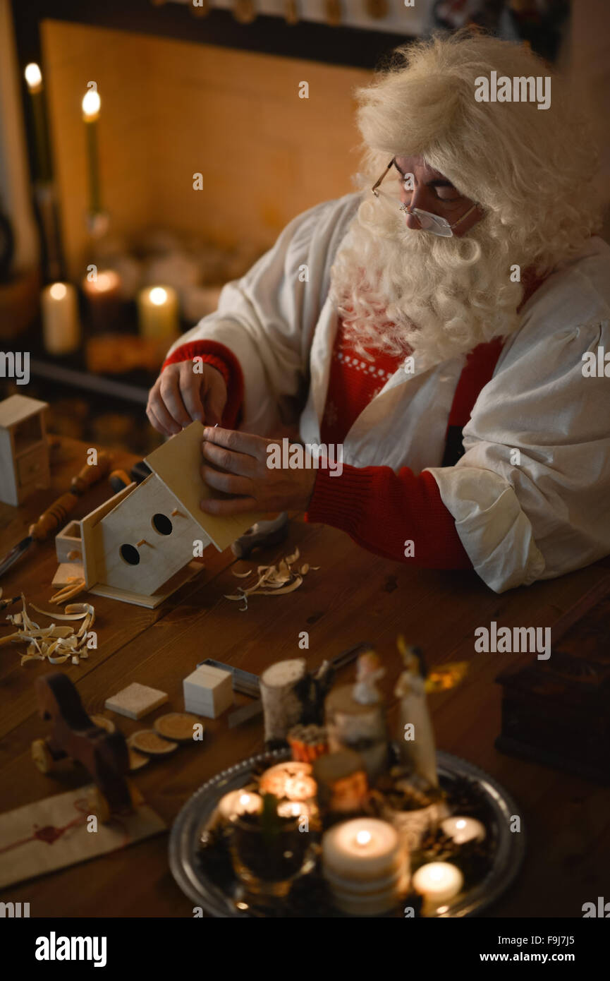 Santa claus home making toys hi-res stock photography and images - Alamy
