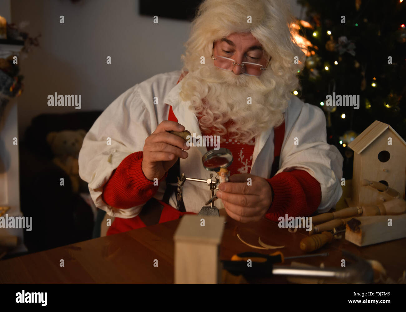 Santa Claus at Home making toys Stock Photo - Alamy