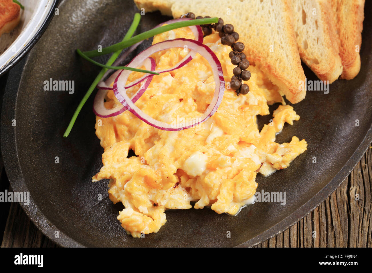 Breakfast - Scrambled eggs and toasted bread Stock Photo - Alamy