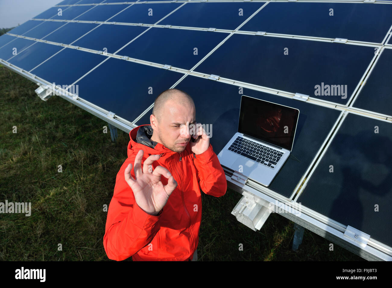 business man engineer using laptop at solar panels plant eco energy ...