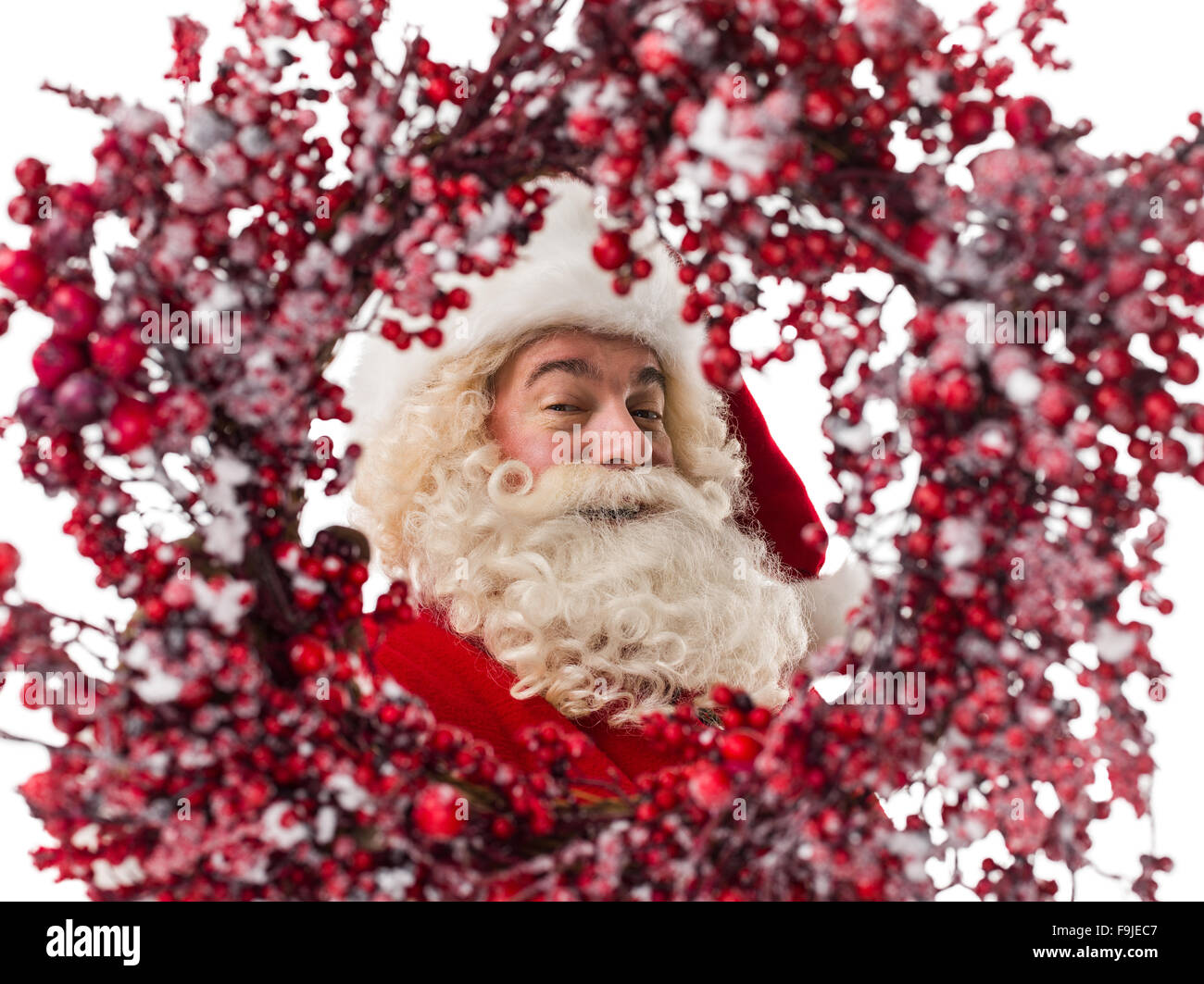Santa Claus holding wreath as a frame Closeup Portrait Isolated on ...