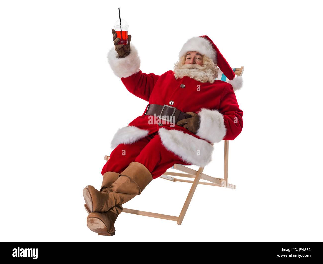 Santa Claus sitting on deck chair and drinking cocktail Full Length ...