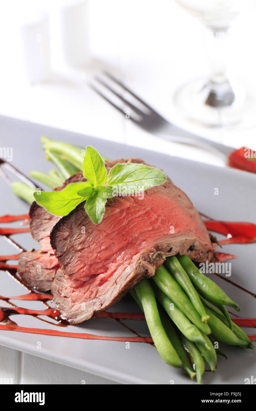 Roast beef and string beans Stock Photo - Alamy