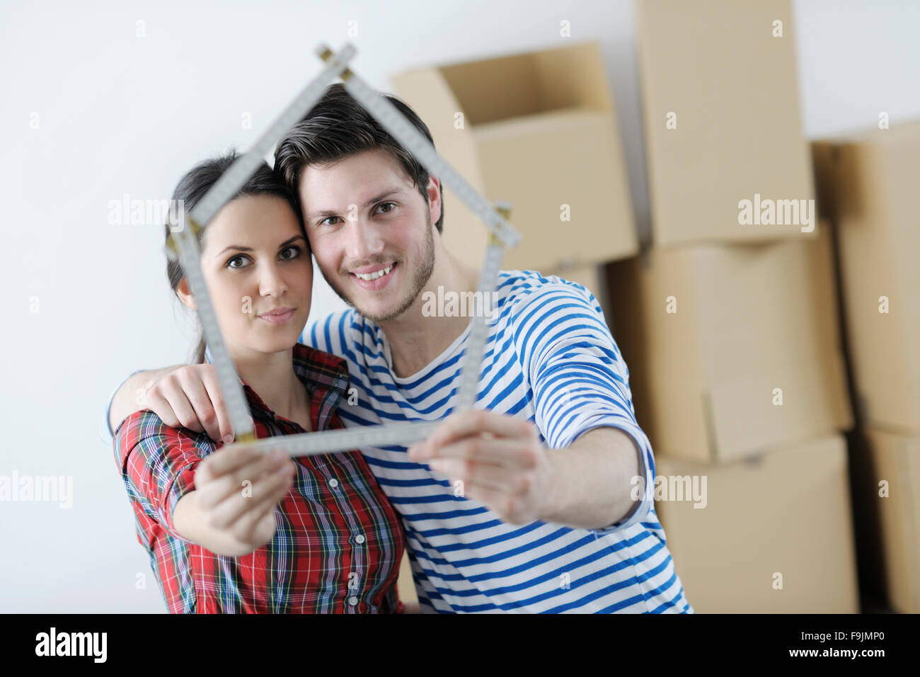 happy Young couple moving in new home Stock Photo - Alamy