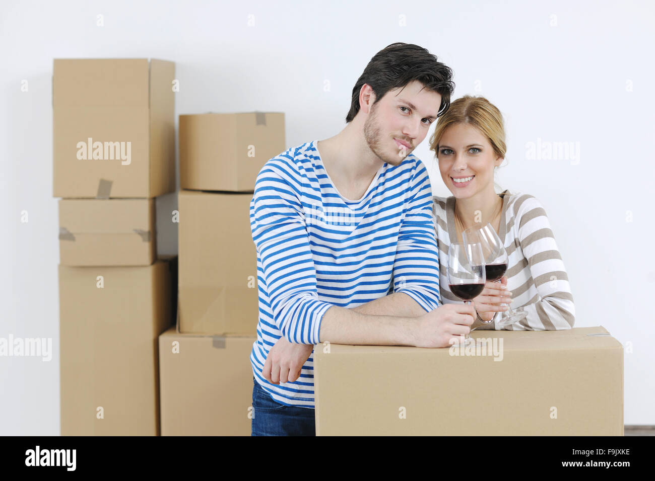 happy Young couple moving in new home Stock Photo - Alamy