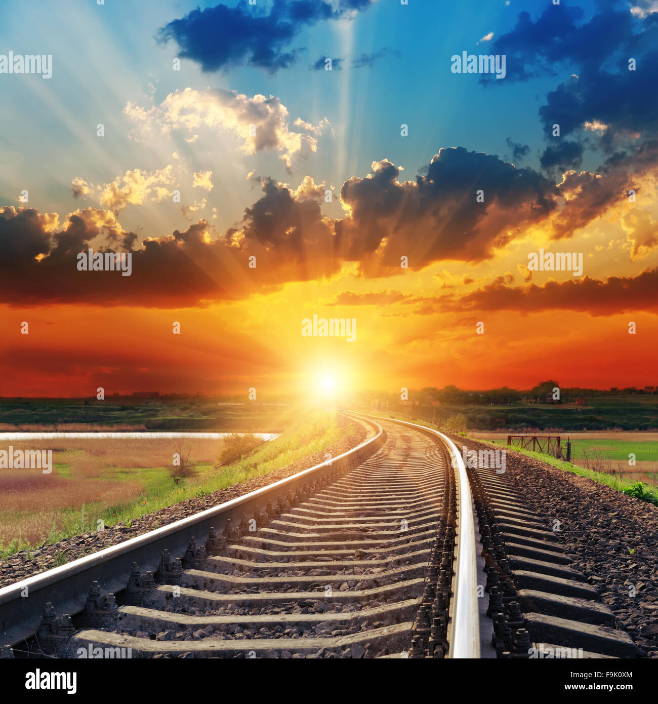 dramatic sunset over railroad Stock Photo - Alamy
