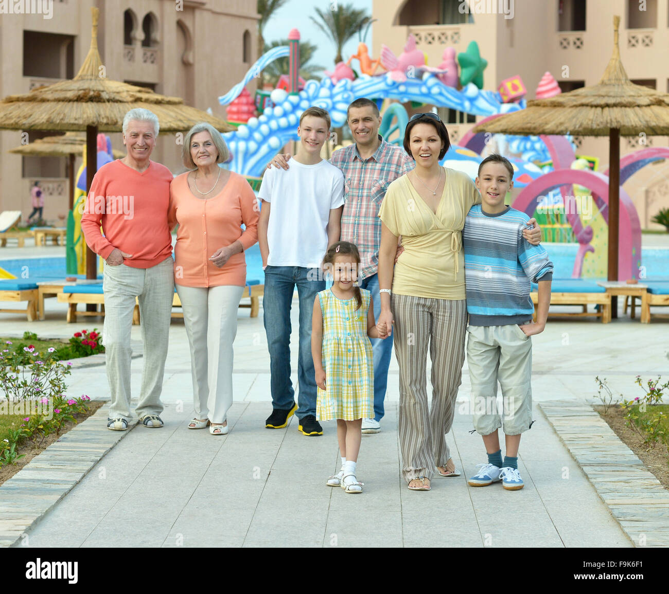 Family relaxing at resort Stock Photo - Alamy