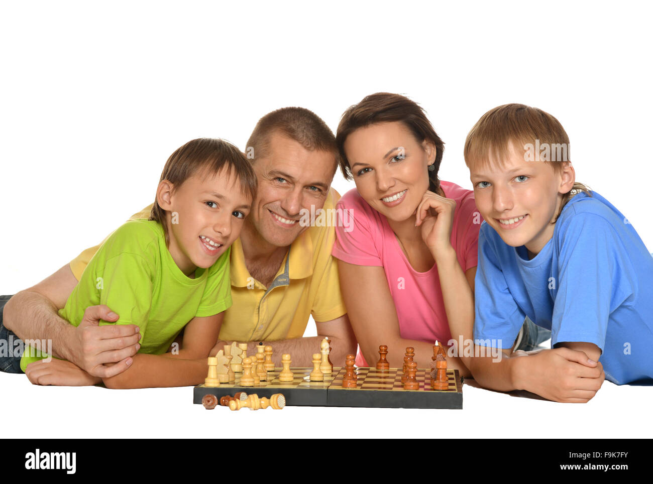 Happy family playing chess Stock Photo - Alamy