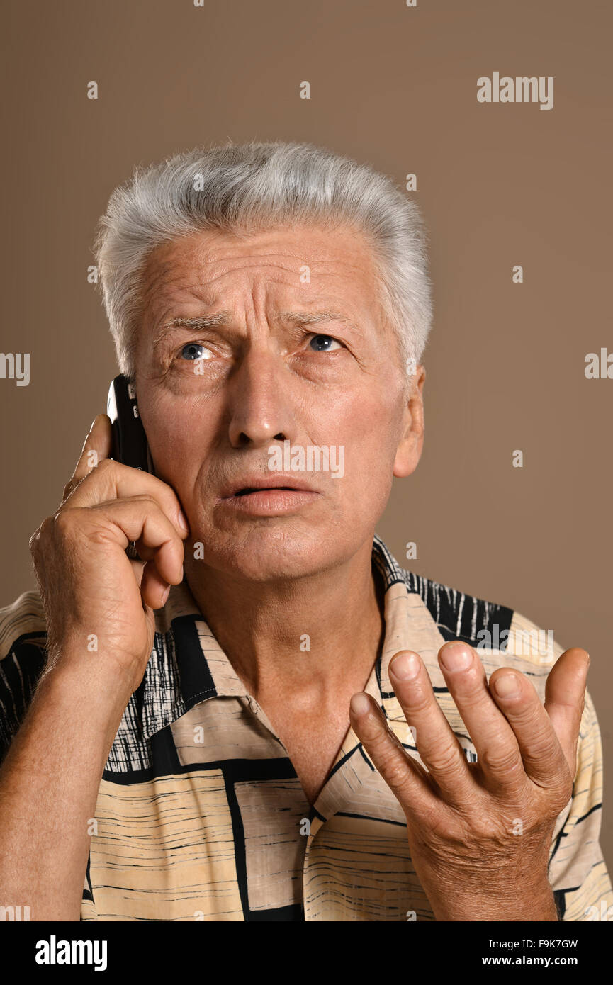 Elderly man with phone Stock Photo - Alamy