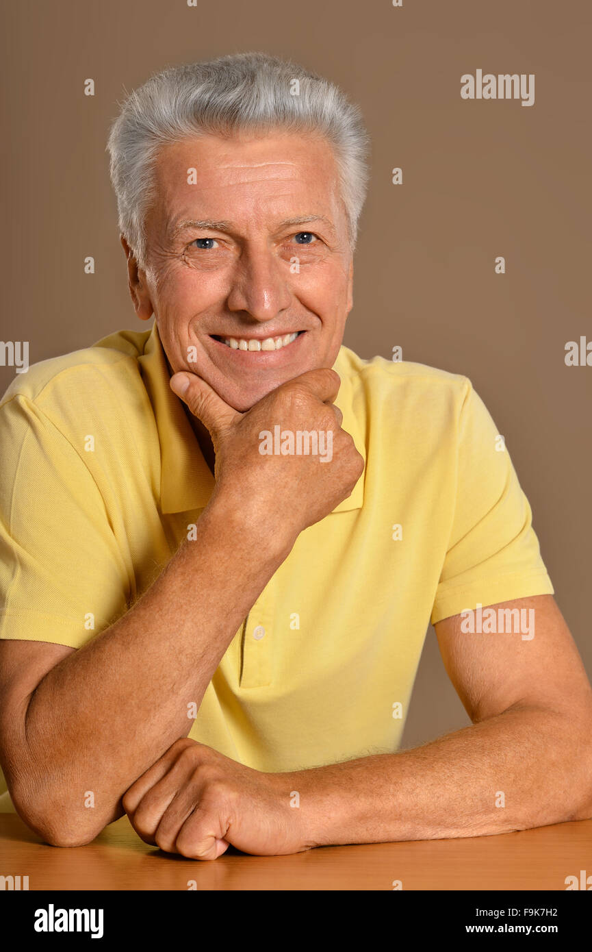 Thoughtful smiling elder man Stock Photo - Alamy